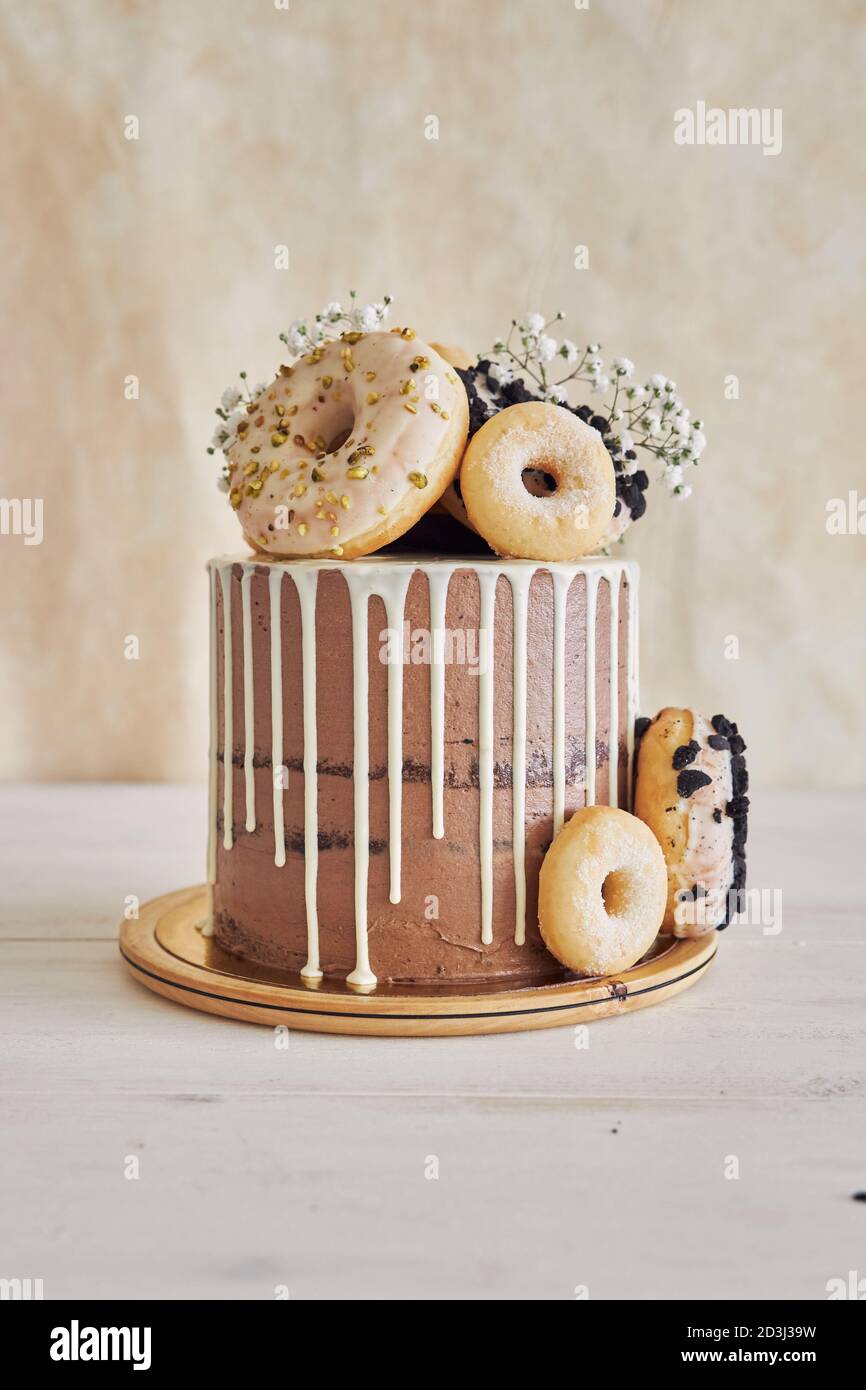 Vertical closeup shot of delicious Donut choco Birthday cake with ...