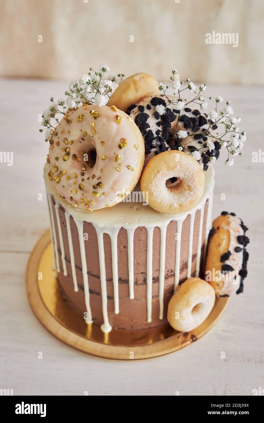 Vertical closeup shot of delicious Donut choco Birthday cake with ...