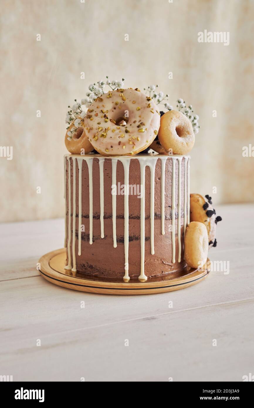 Vertical closeup shot of delicious Donut choco Birthday cake with ...