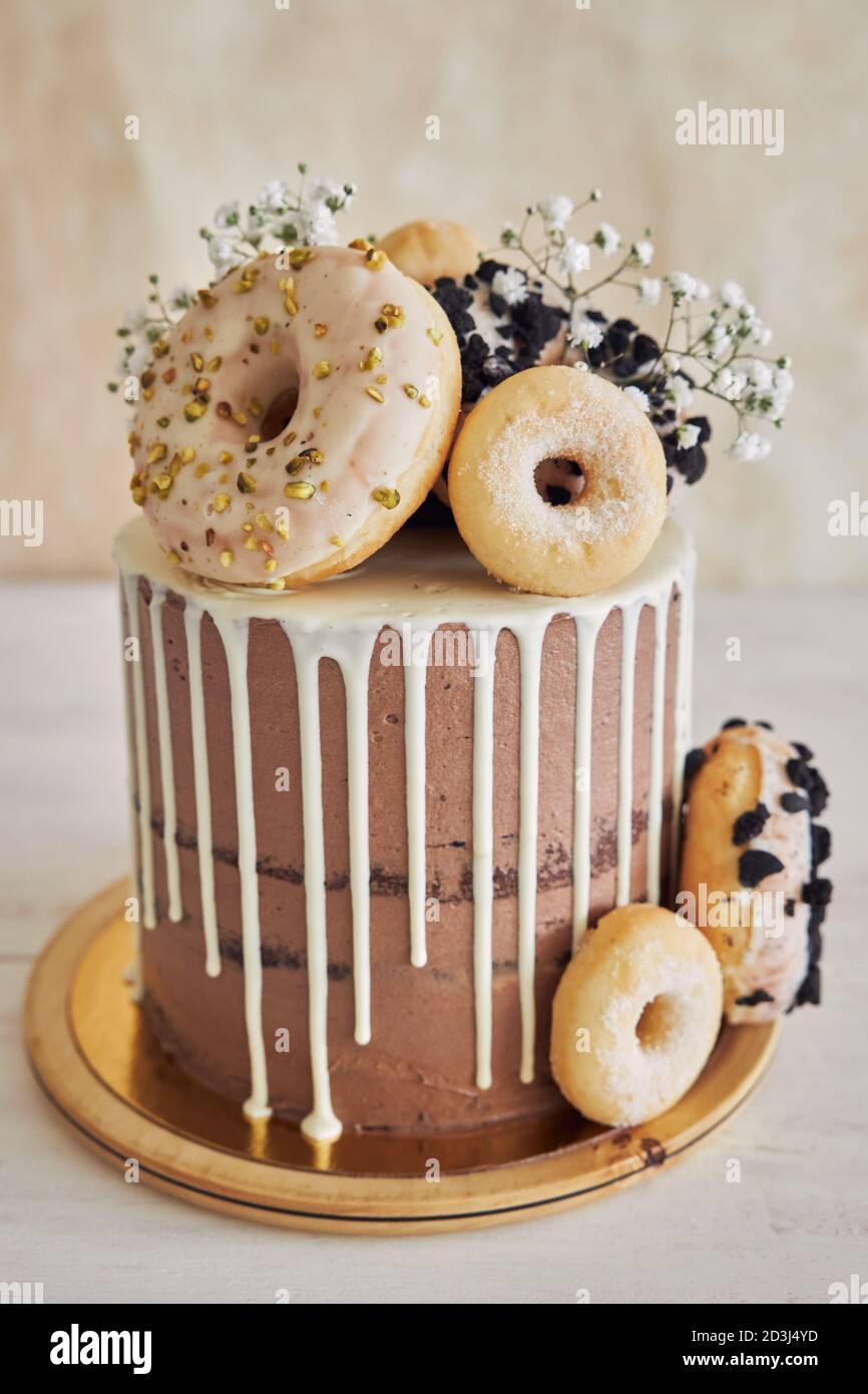 Vertical closeup shot of delicious Donut choco Birthday cake with ...