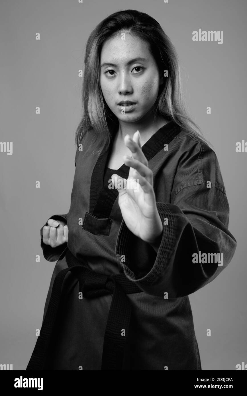 Portrait of young Asian woman wearing karate Gi ready to fight Stock ...