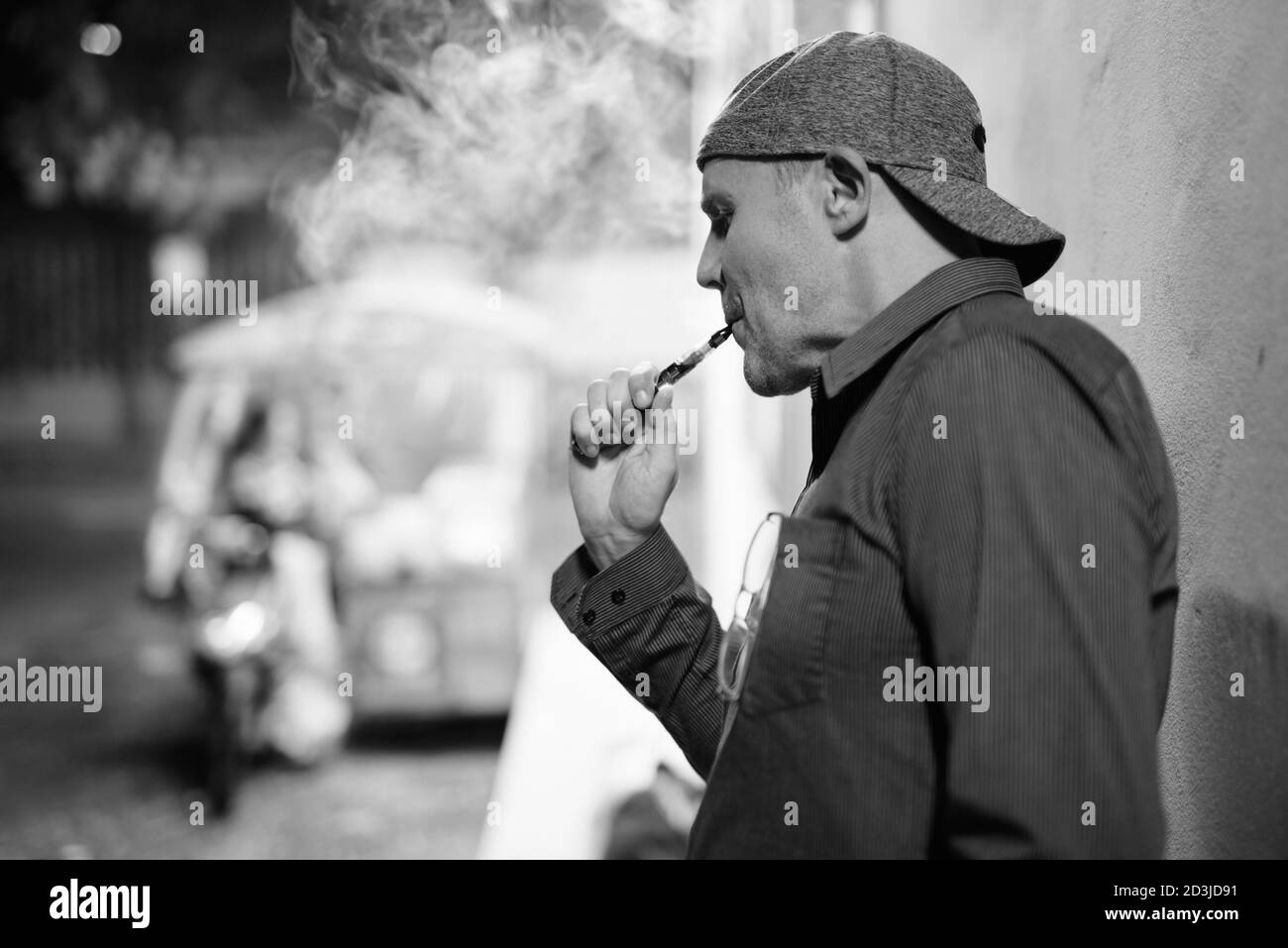 Smoking side view Black and White Stock Photos & Images - Alamy