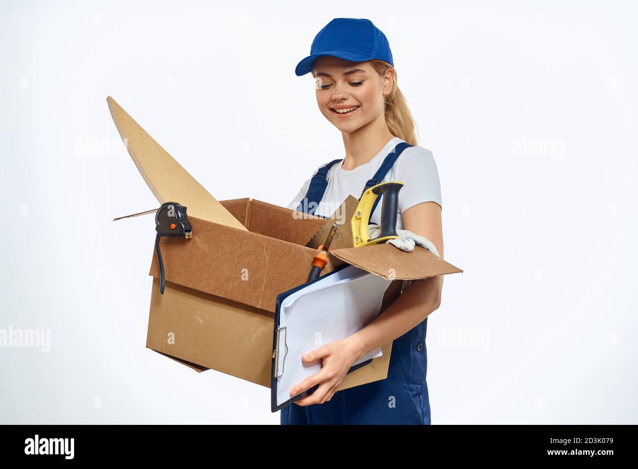 Woman working with box in hands of tools delivery service light ...