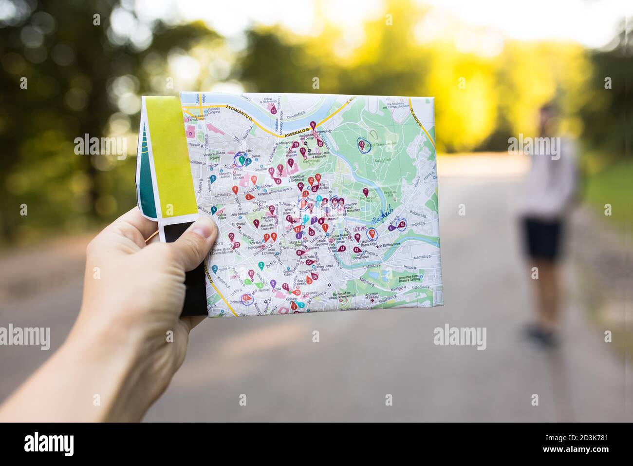 Discovering new places in the city by using a tourist map Stock Photo ...