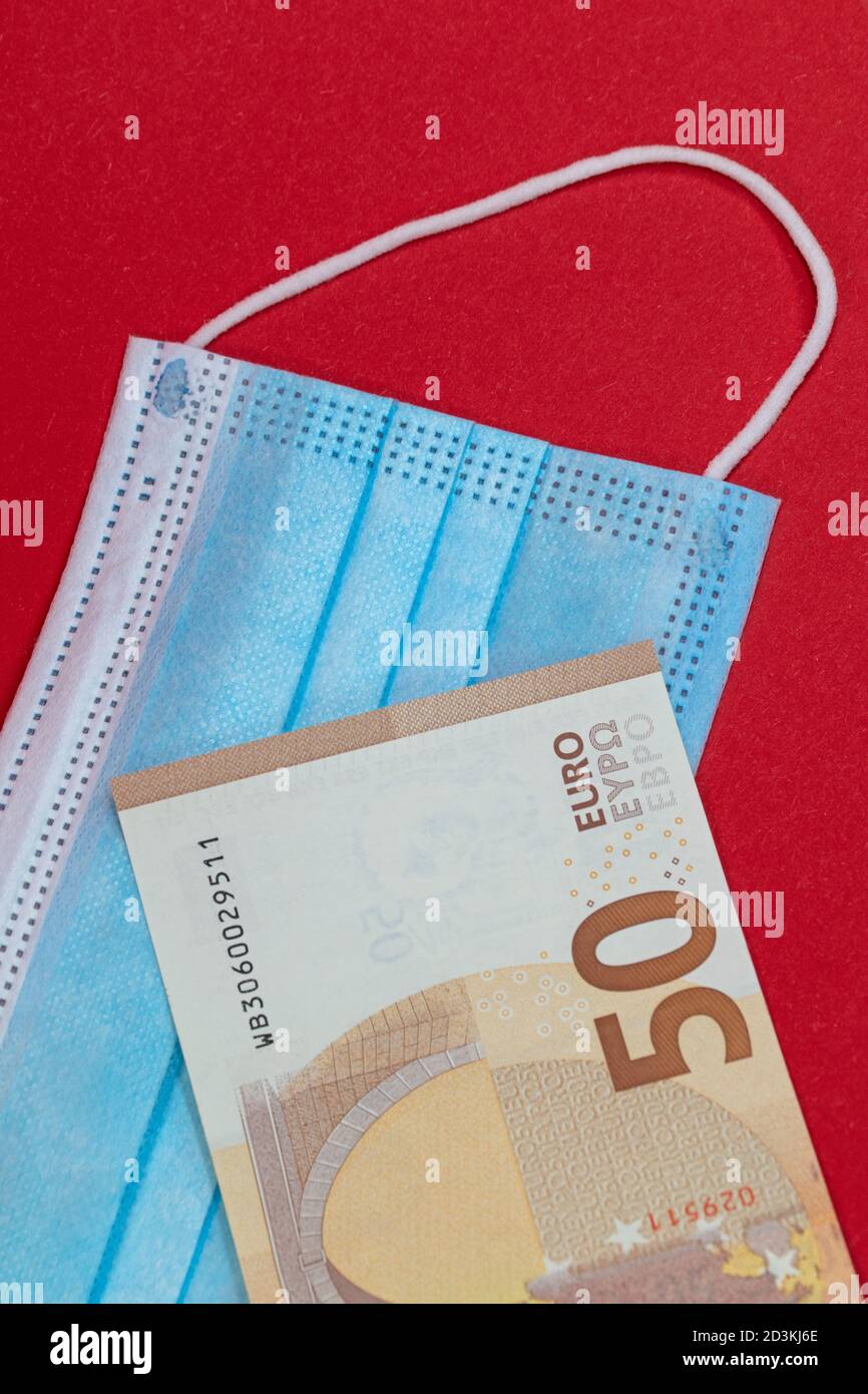 Respirator and banknotes, caution money Stock Photo - Alamy