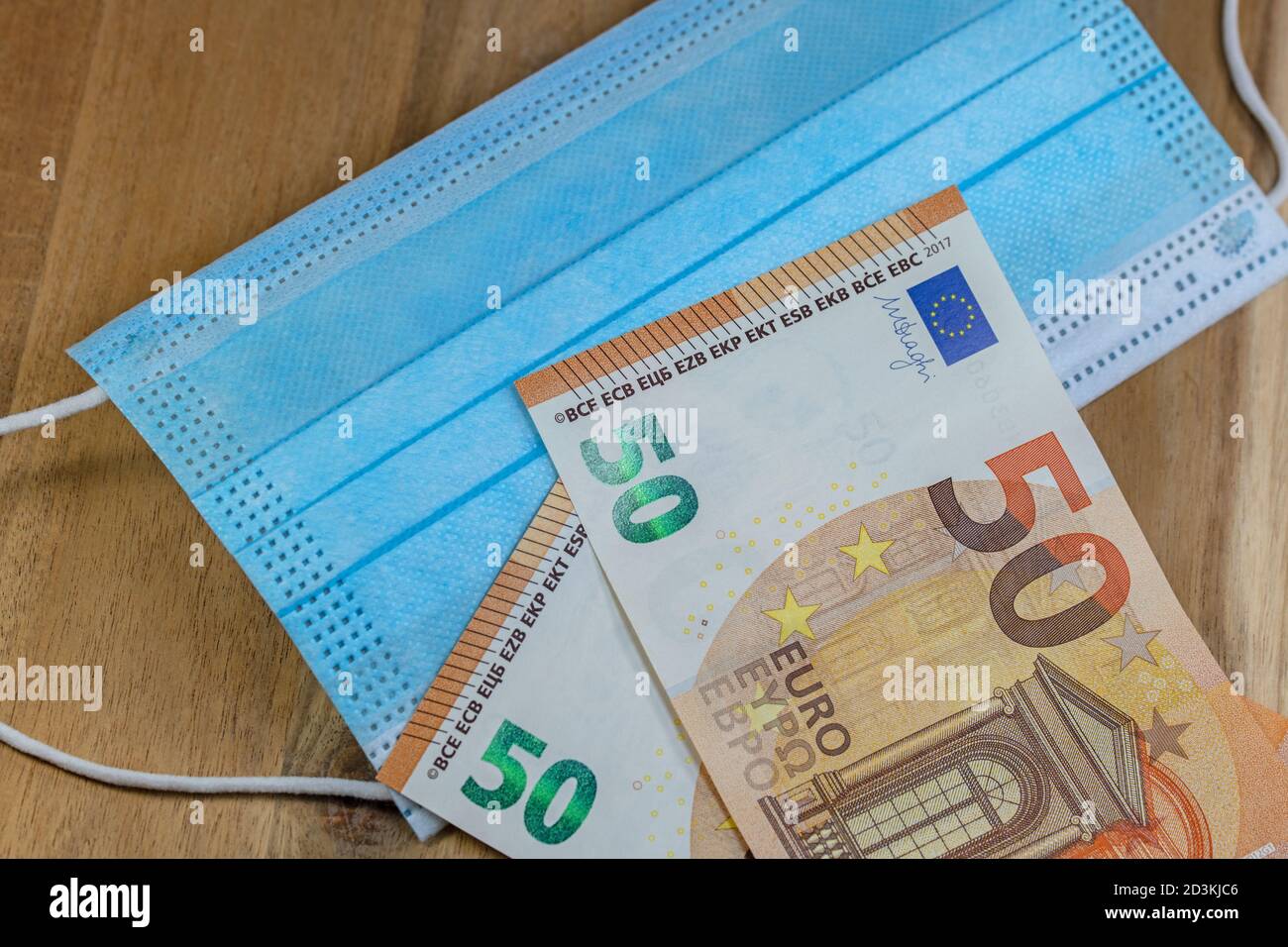 Respirator and banknotes, caution money Stock Photo - Alamy