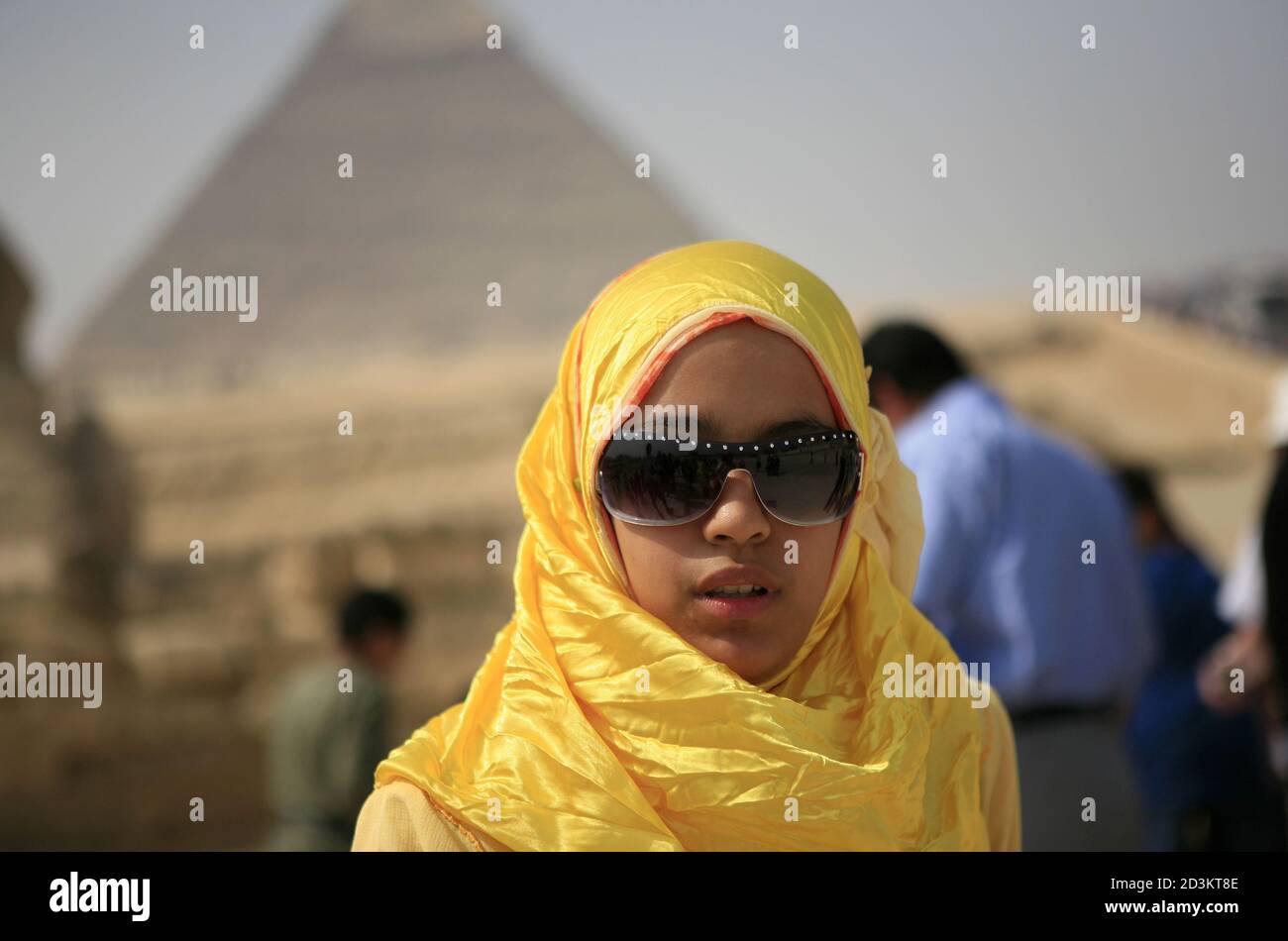 View of the pyramid and an arabic woman in Giza near Cairo Stock Photo ...