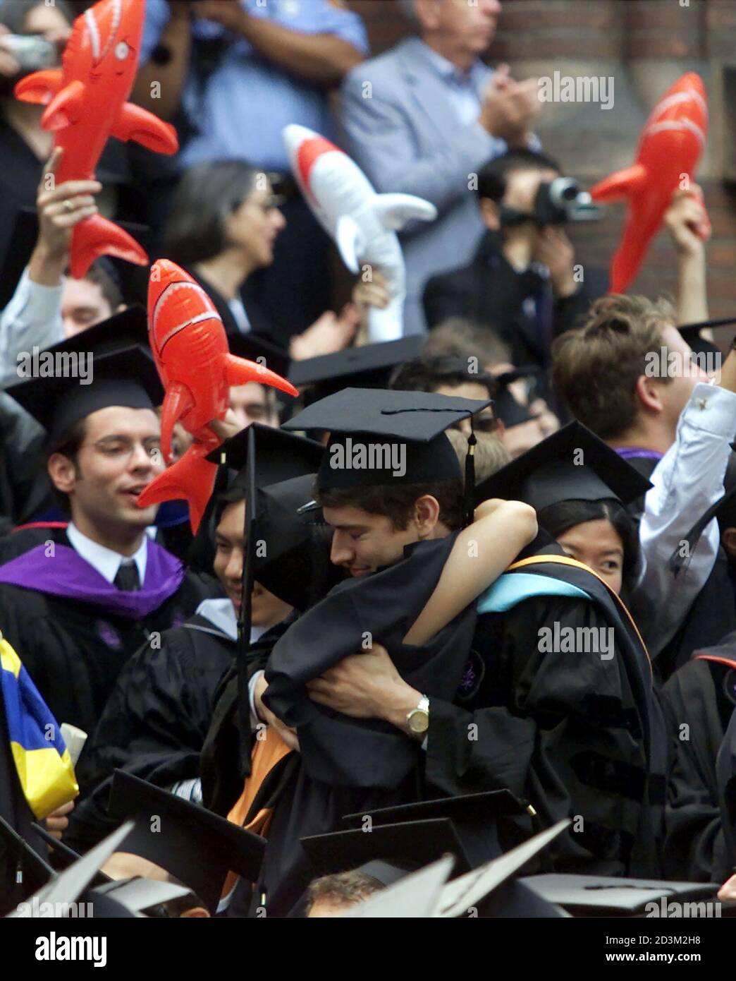 Harvard Law School Graduates Hug And Celebrate As Other Graduates Hold harvard-law-school-graduates-hug-and-celebrate-as-other-graduates-hold