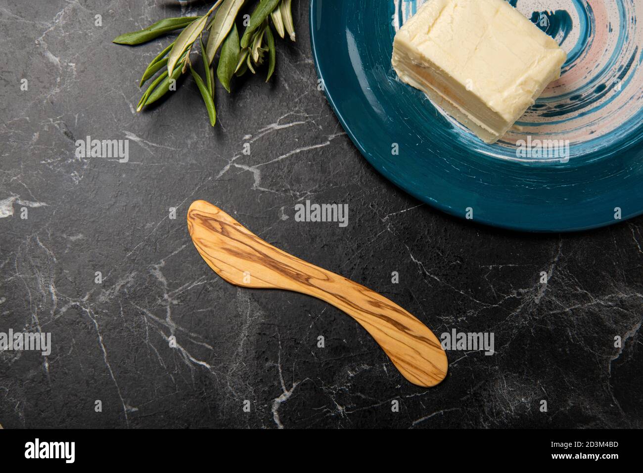 wooden butter knife with butter on breakfast table Stock Photo - Alamy