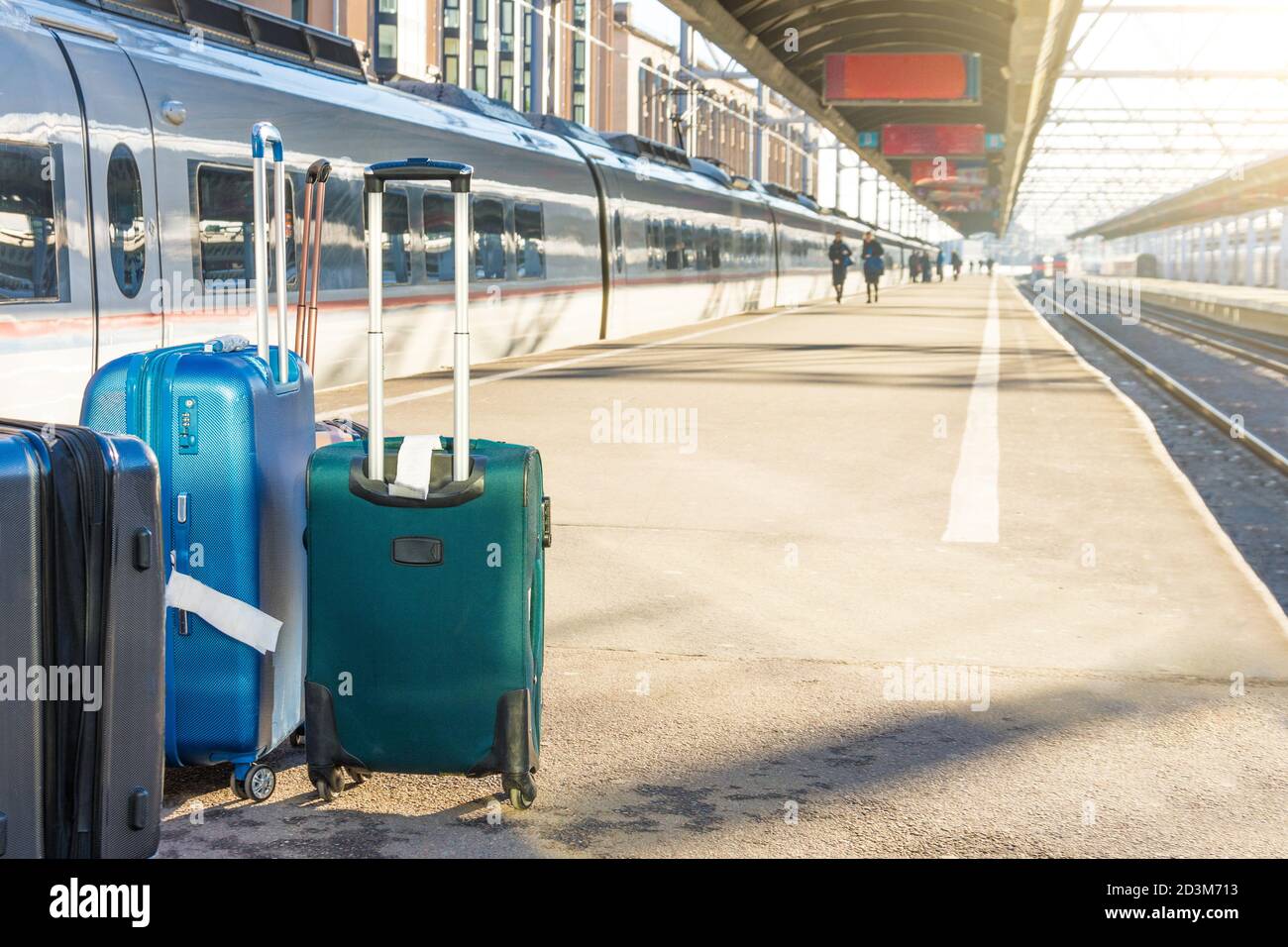 Rolling bags, luggage suitcases on the platform of the railway ...
