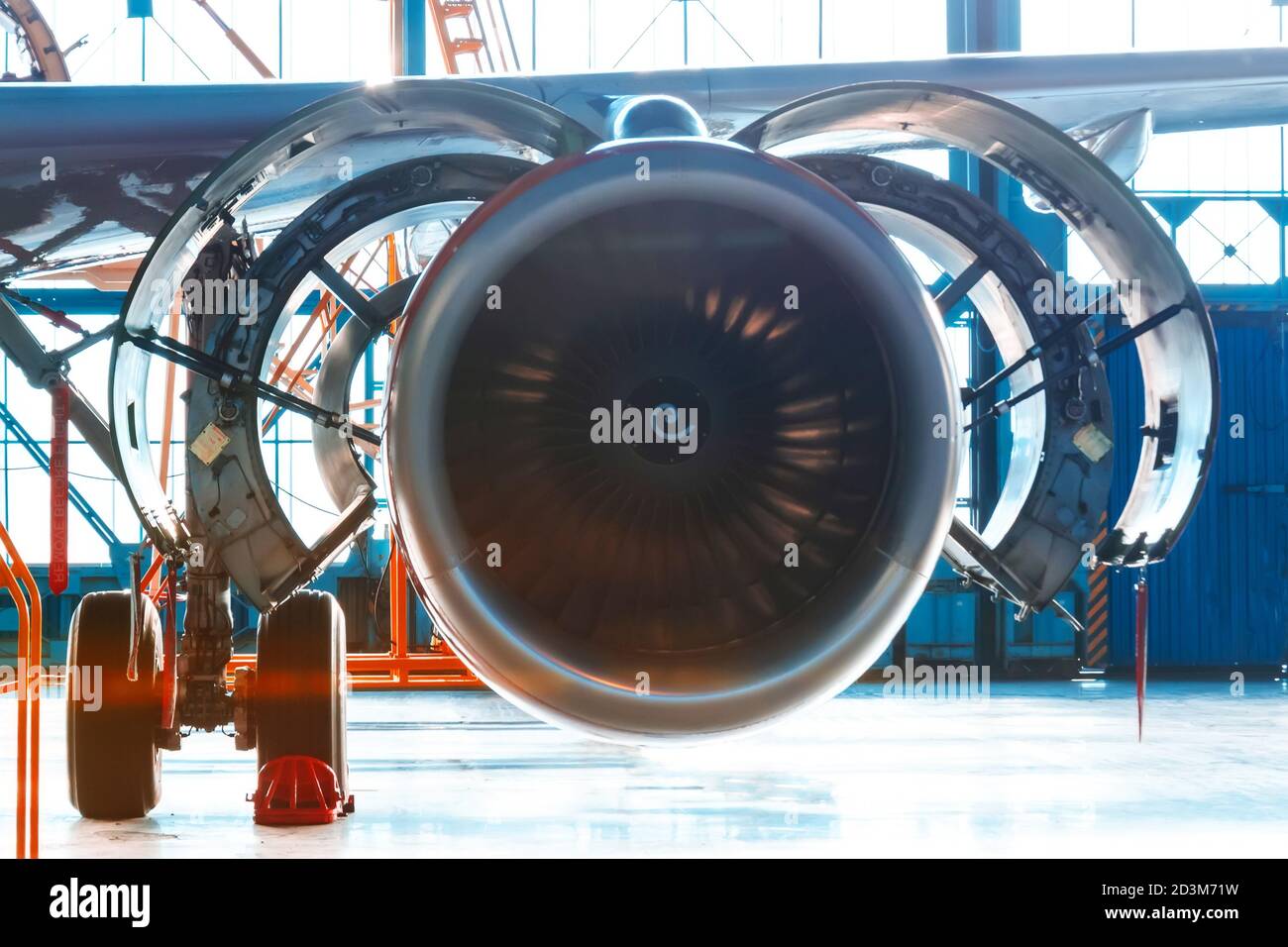 Aircraft engine repair, open hood flap. View of the wing with jet ...