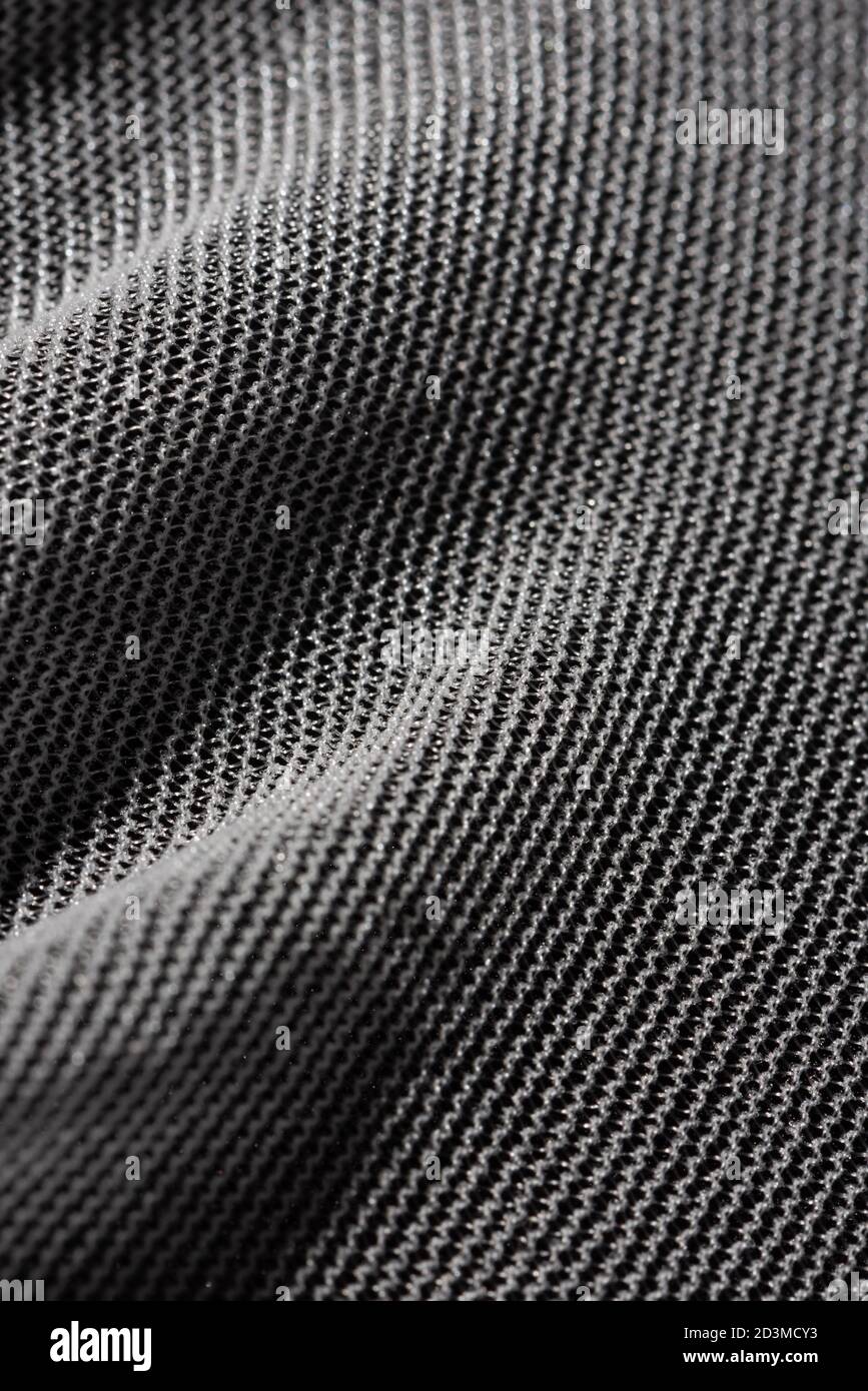 Texture of a fine white mesh on black background Stock Photo - Alamy