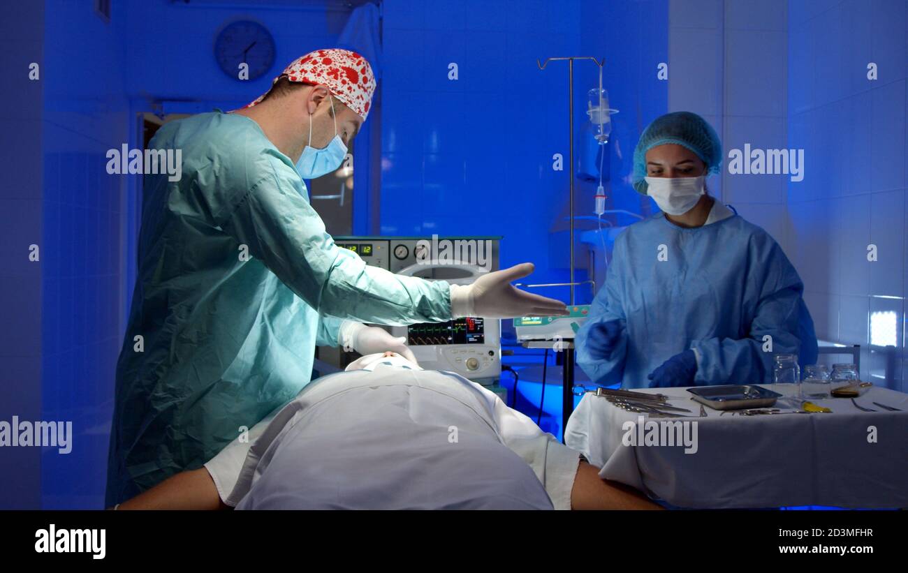 Surgeon doing surgery in operating room in hospital Stock Photo - Alamy