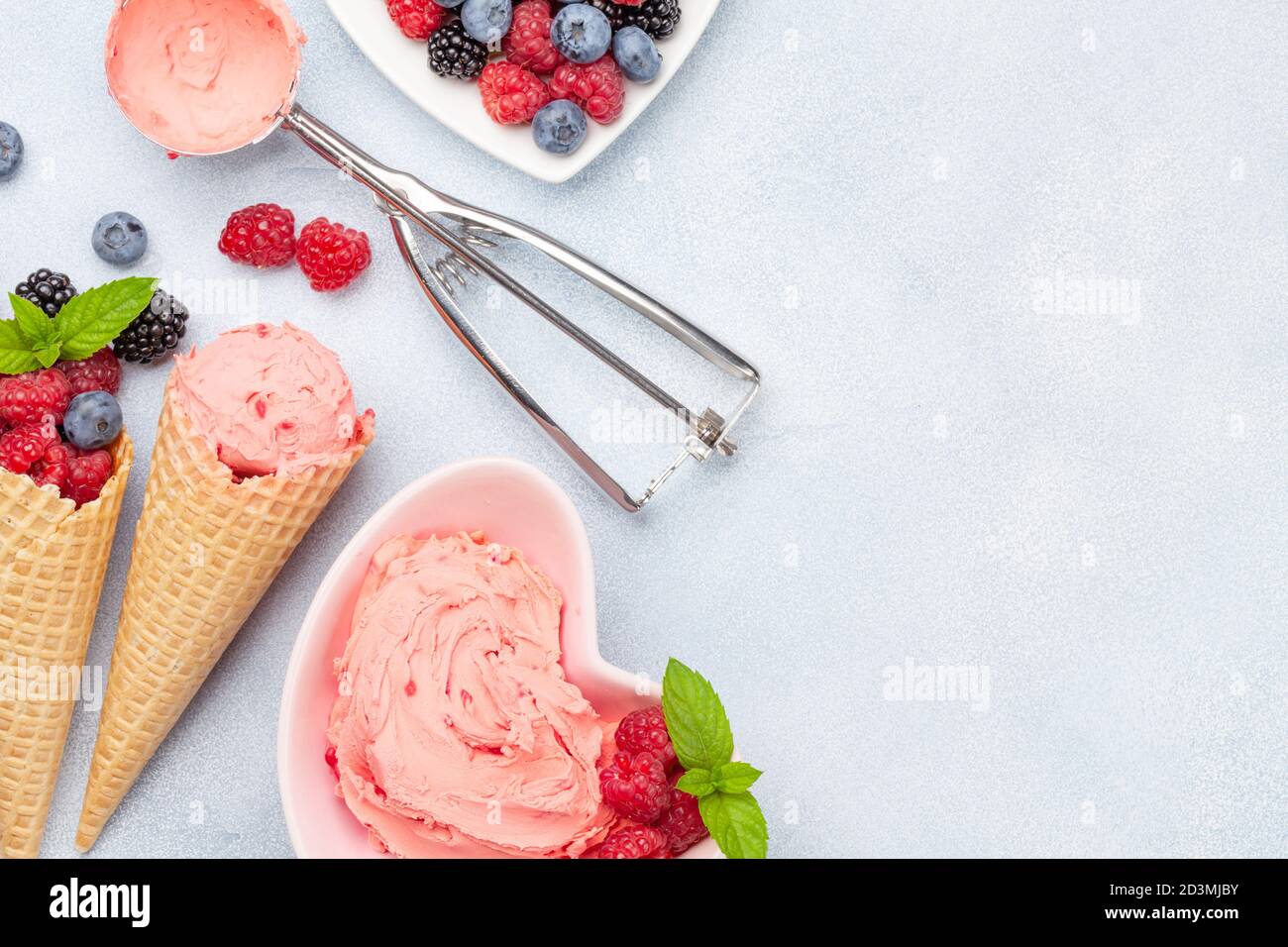 Homemade berry and vanilla ice cream sundae. Top view flat lay with ...