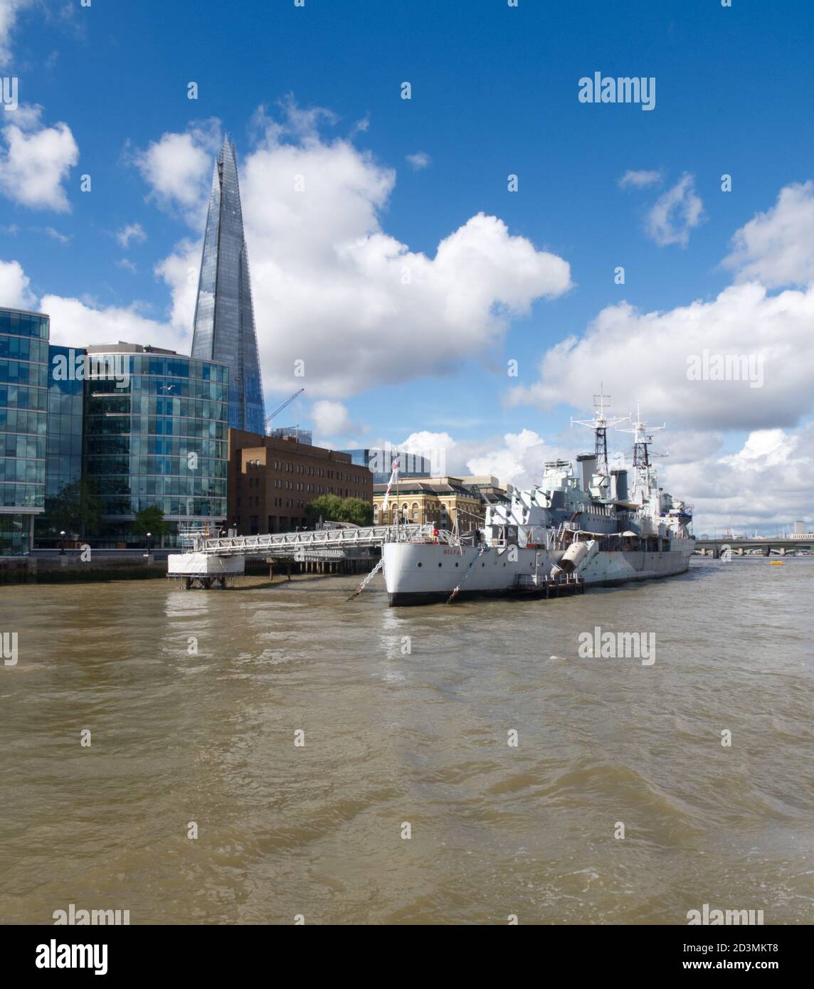 HMS Belfast, docked on Queens Walk, on the Embankment of London's River ...