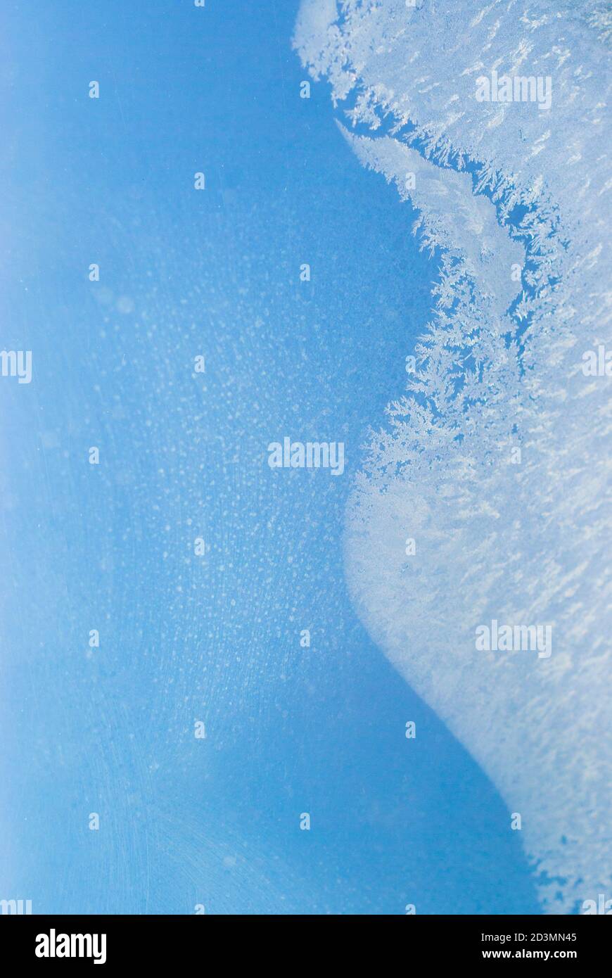 Frozen window inside airplane covered with ice during flight, closeup ...