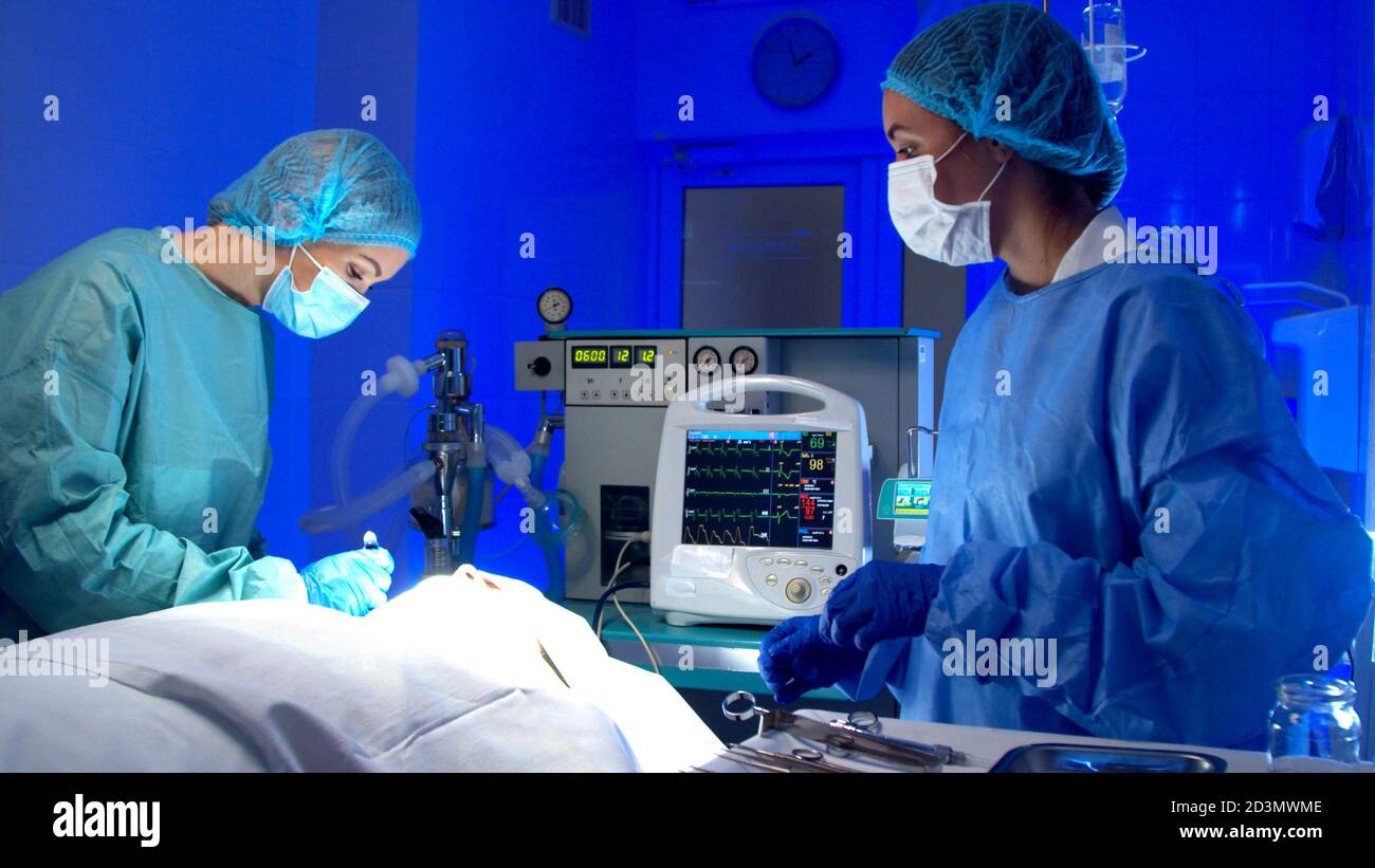 Surgeon doing surgery in operating room in hospital Stock Photo - Alamy