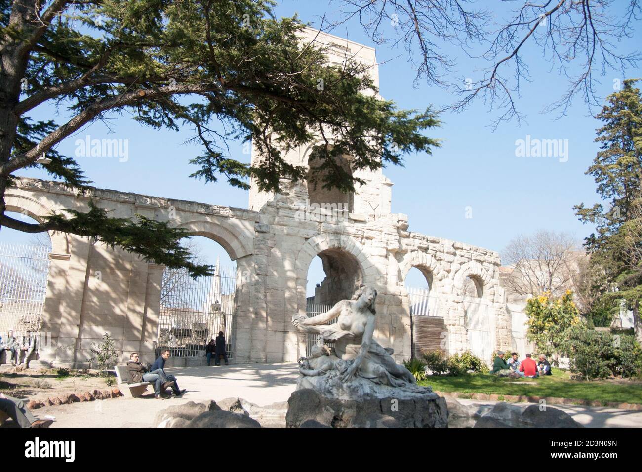 Singing nymph under the pine. Neoclassical fountain with a nymph statue ...