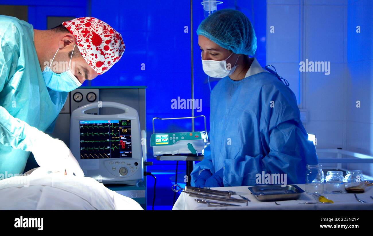 Surgeon doing surgery in operating room in hospital Stock Photo - Alamy