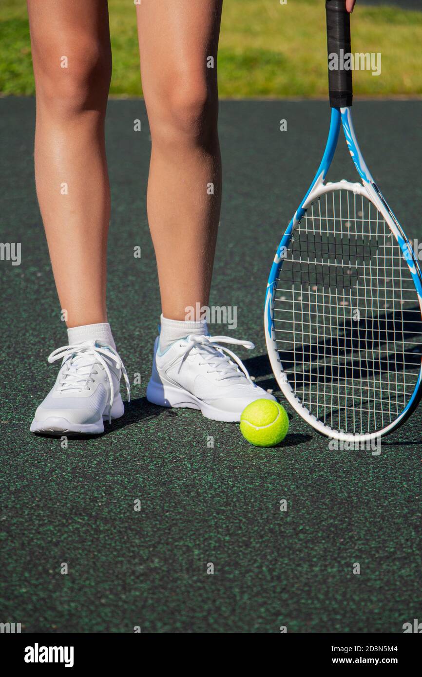 A tennis player with a racket stands on the tennis court. Sport Stock ...