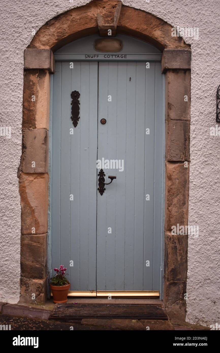 Cottage entrance with blue door Stock Photo - Alamy