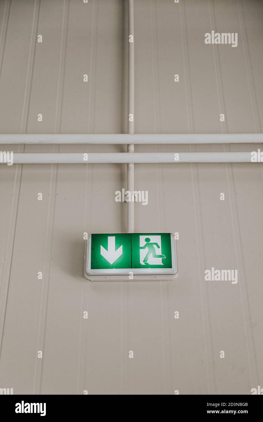 Green lit emergency exit sign hi-res stock photography and images - Alamy