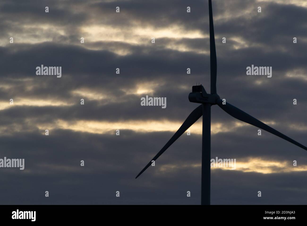Windmill in the sunset of Uruguay Stock Photo - Alamy