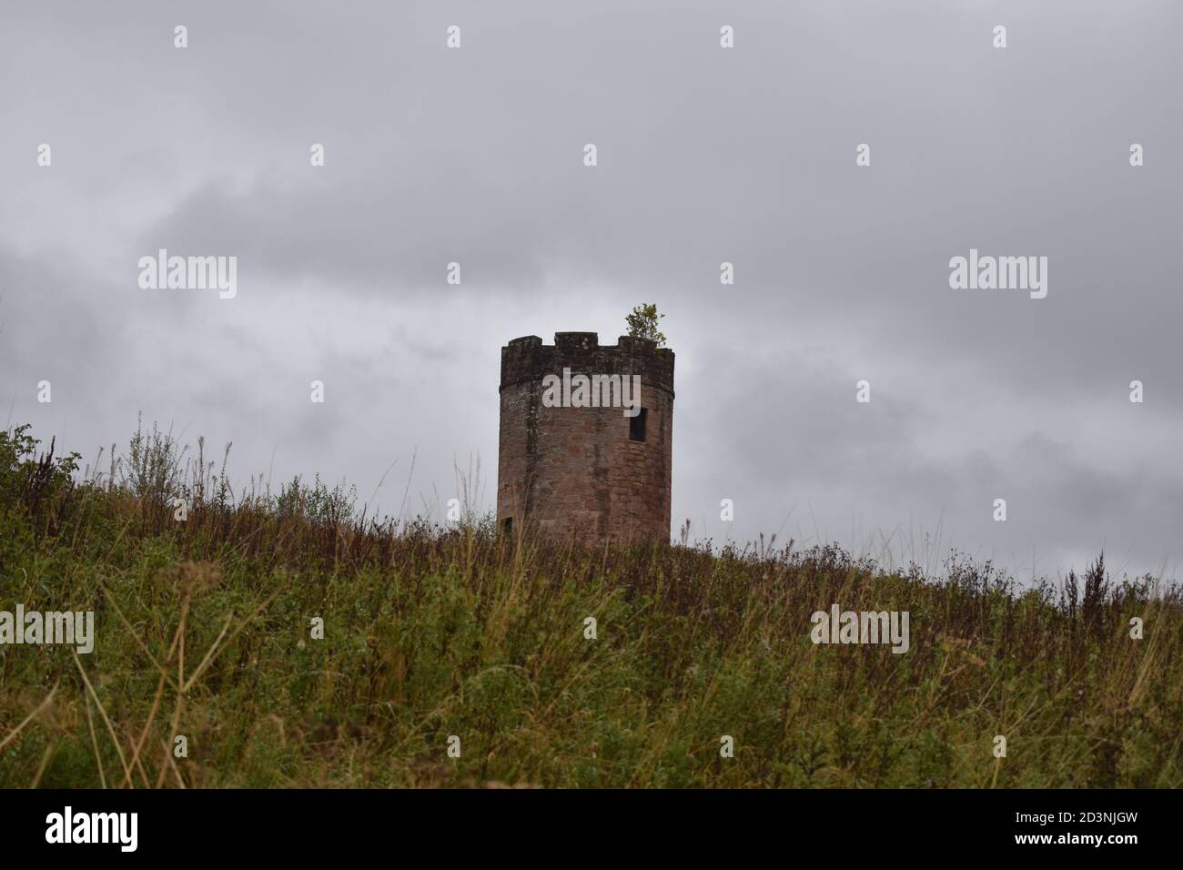 Castle windmill on hill in Scotland Stock Photo - Alamy