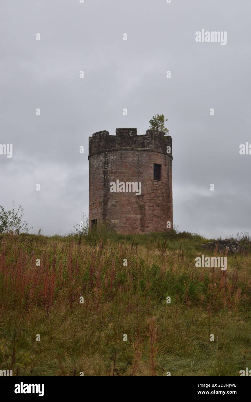 Castle windmill on hill in Scotland Stock Photo - Alamy