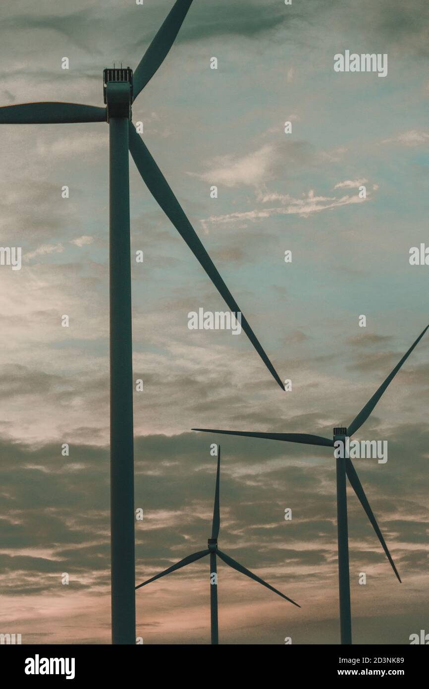 Windmill in the sunset of Uruguay Stock Photo - Alamy