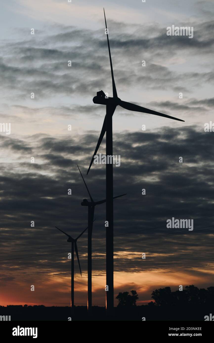 Windmill in the sunset of Uruguay Stock Photo - Alamy