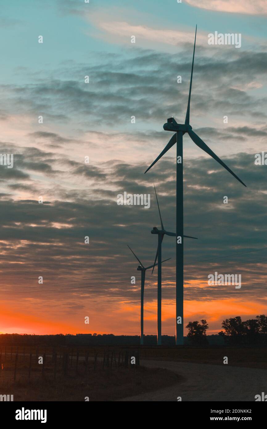 Windmill in the sunset of Uruguay Stock Photo - Alamy
