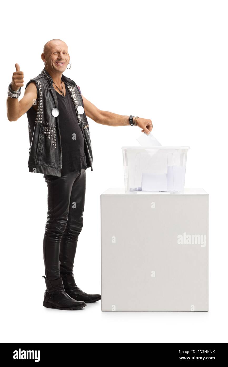 Full length portrait of a punk putting a vote in an election box and ...