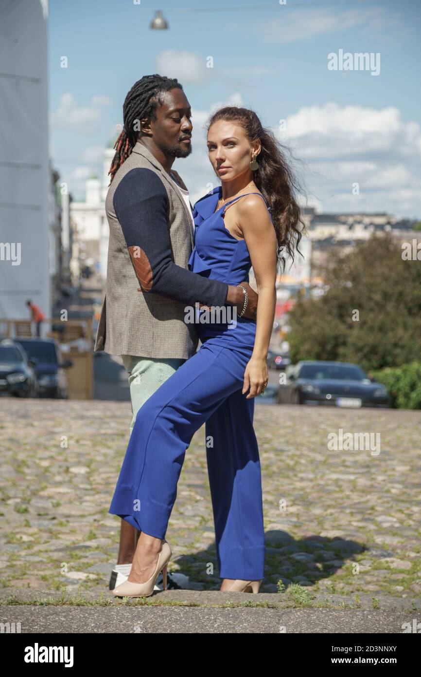 Interracial couple walking in the city. The concept of friendship, love ...