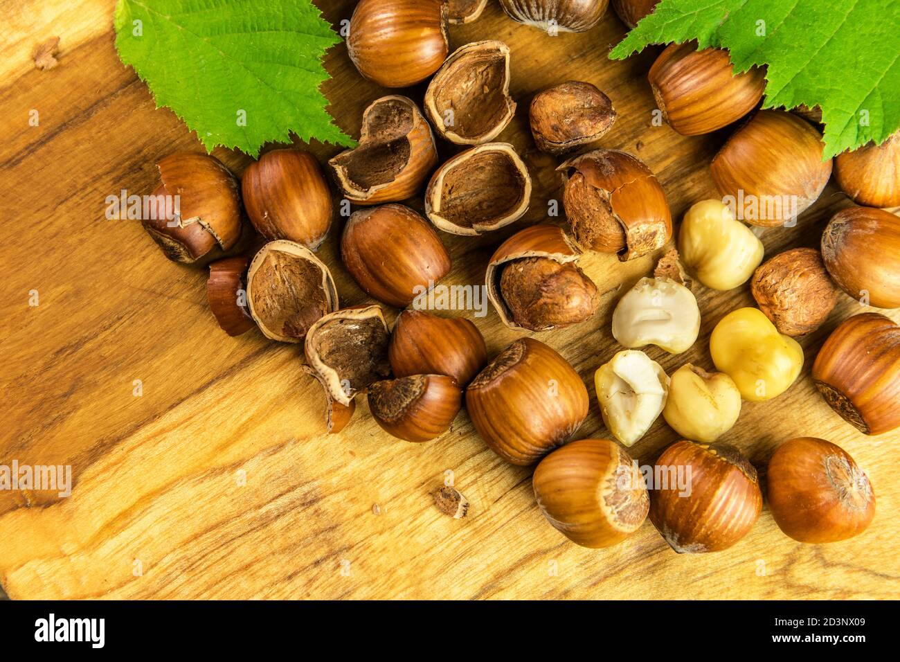 hazelnuts on wooden table, top view. Food background. Heap of many ...