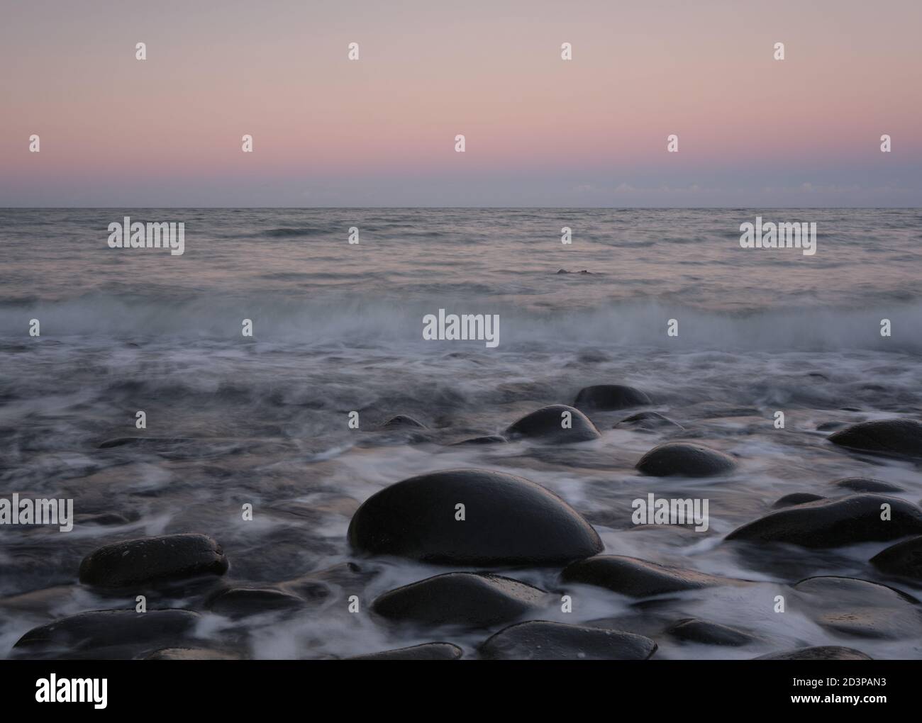 Sunset Colour at the beach with subtle pastel hues Stock Photo - Alamy