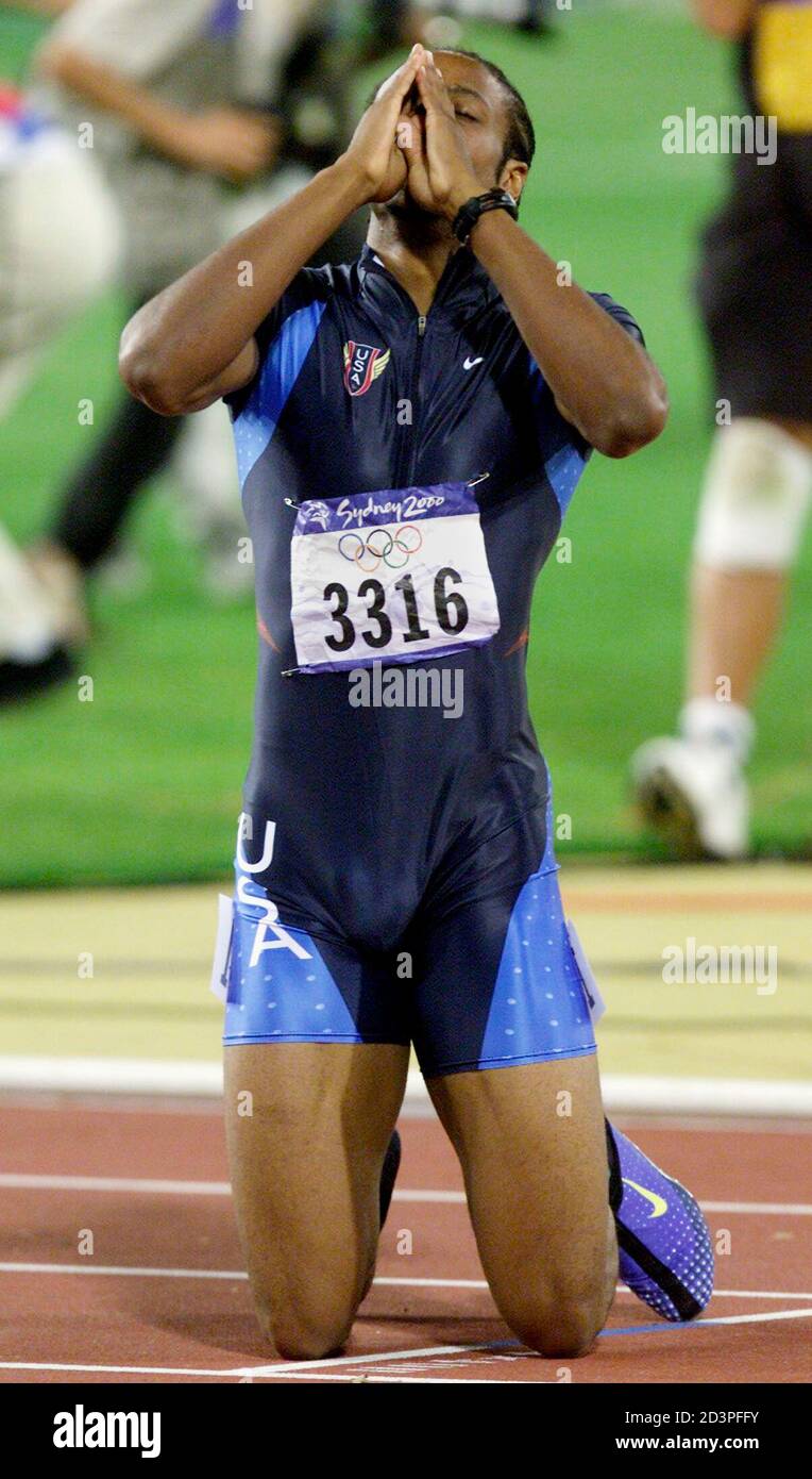 Angelo taylor celebrates winning the mens 400m hurdles hi-res stock ...