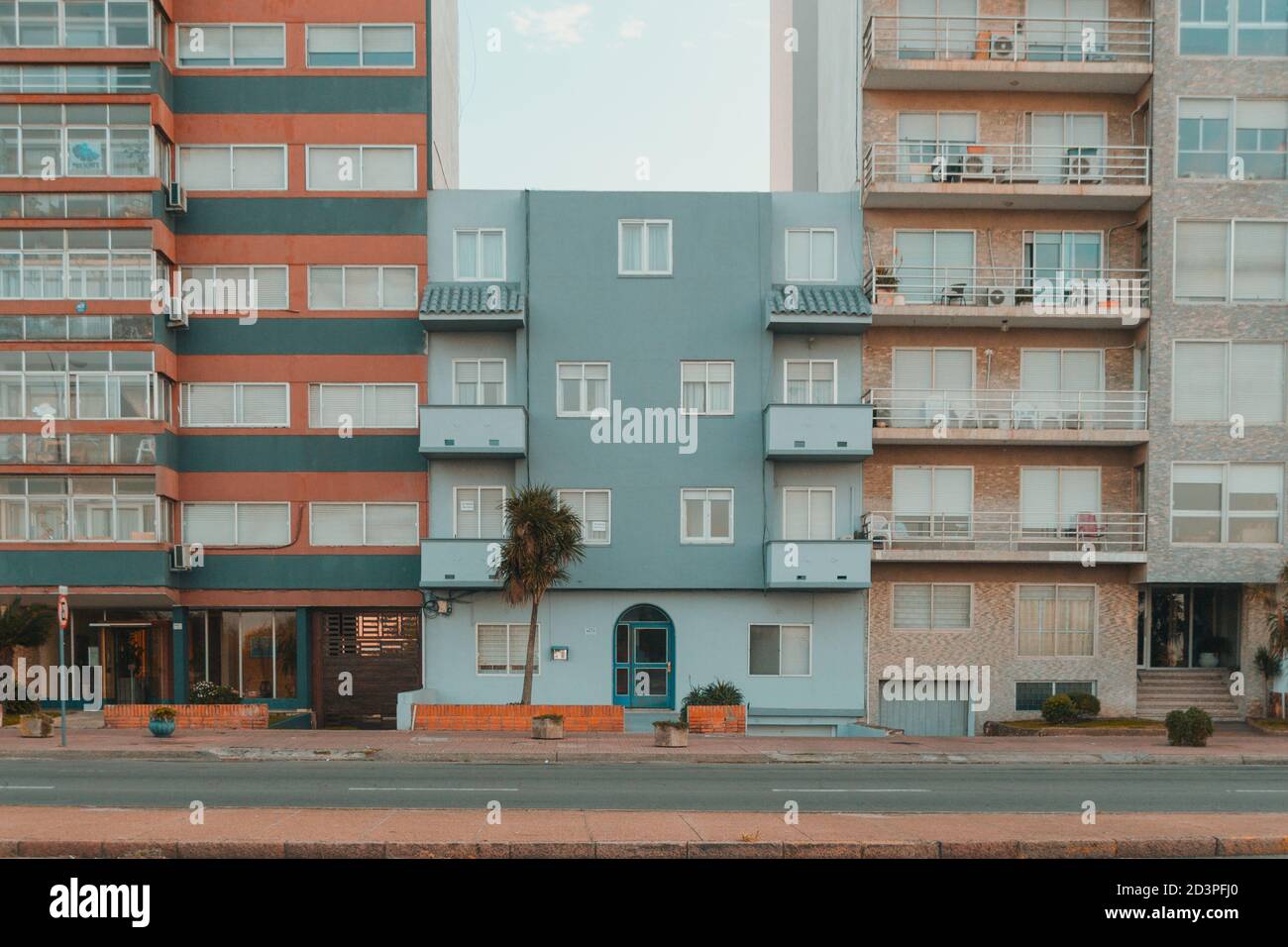 Small house between tall building hi-res stock photography and images ...