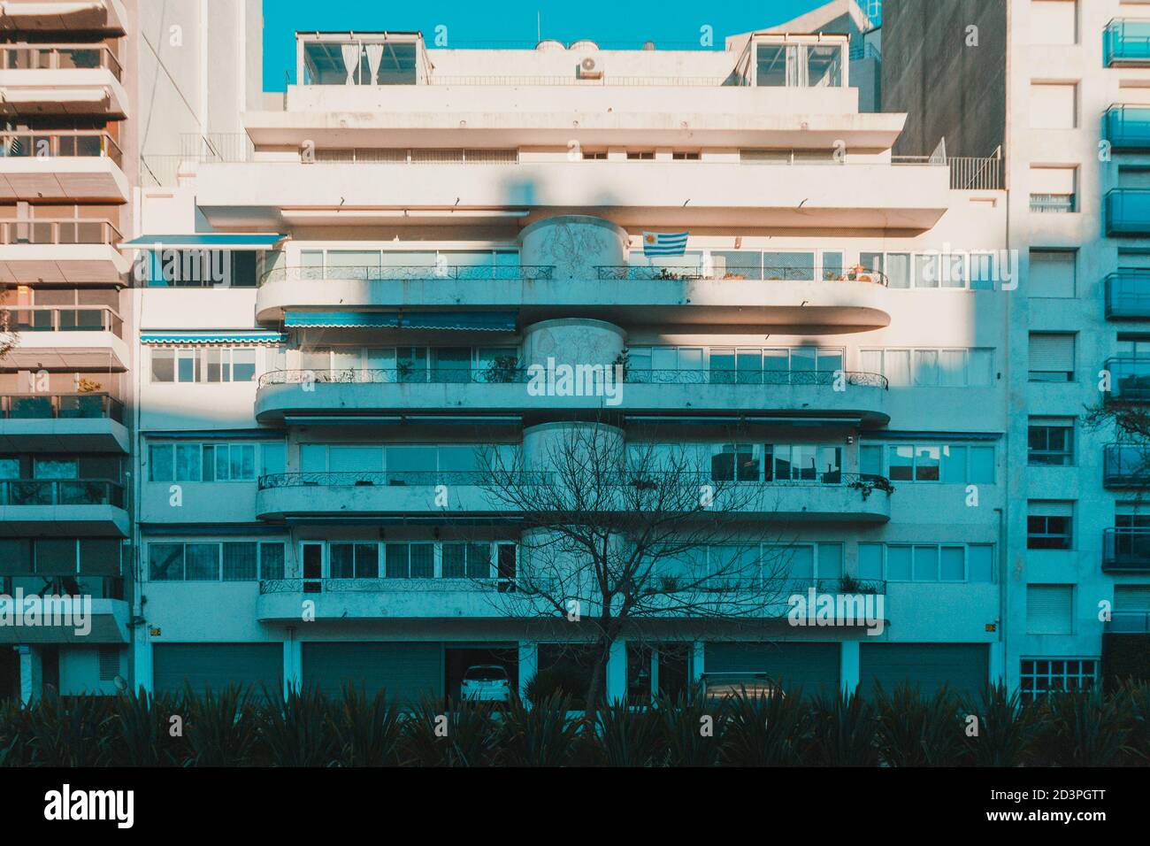 Small building between two tall buildings Stock Photo - Alamy