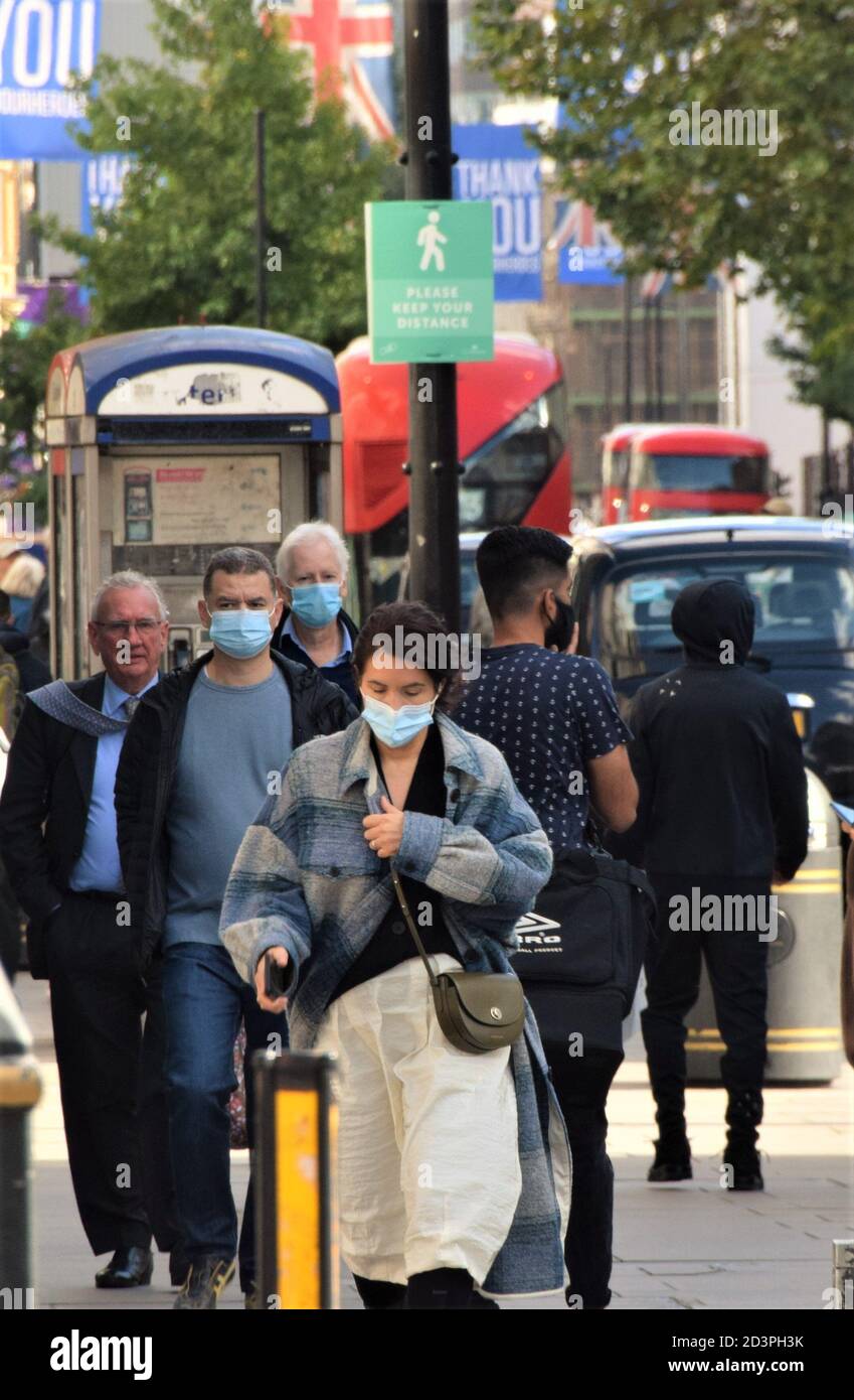 View of a group of people wearing protective face masks on Oxford ...