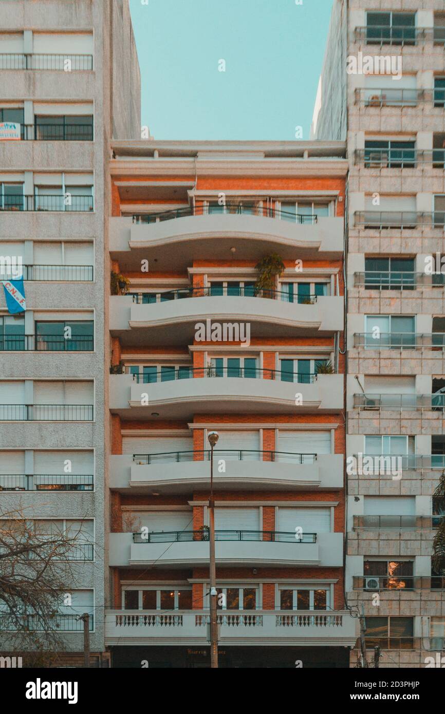 Small building between two tall buildings Stock Photo - Alamy