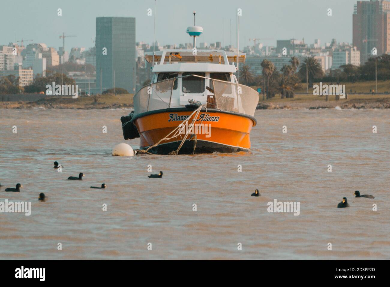 Orange boat in the coast of Montevideo Stock Photo - Alamy
