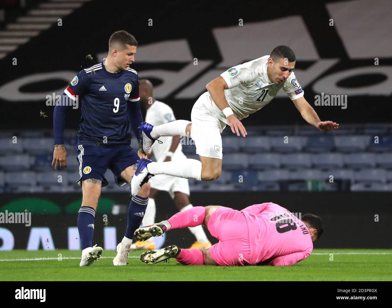 Israel's Eitan Tibi collides with goalkeeper Ofir Martziano during the ...