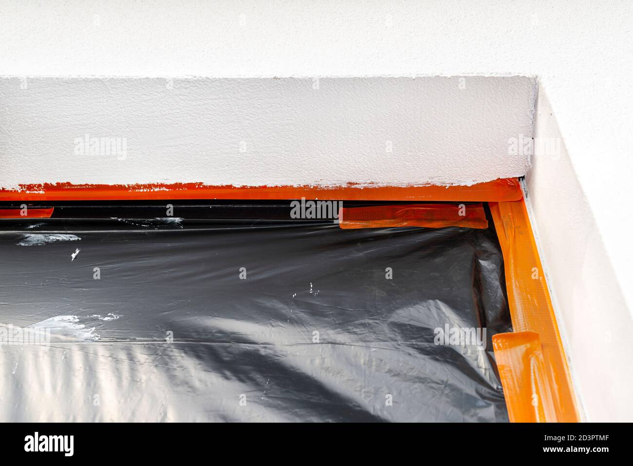 A newly applied layer of silicone plaster on the window jamb, the ...