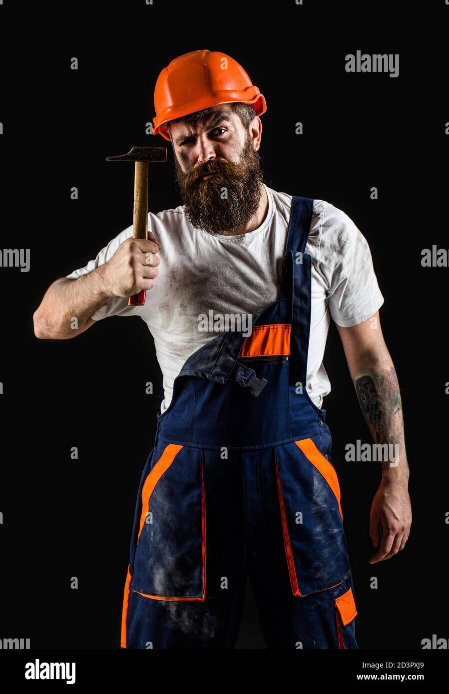 Builder in helmet, hammer, handyman, builders in hardhat. Bearded ...