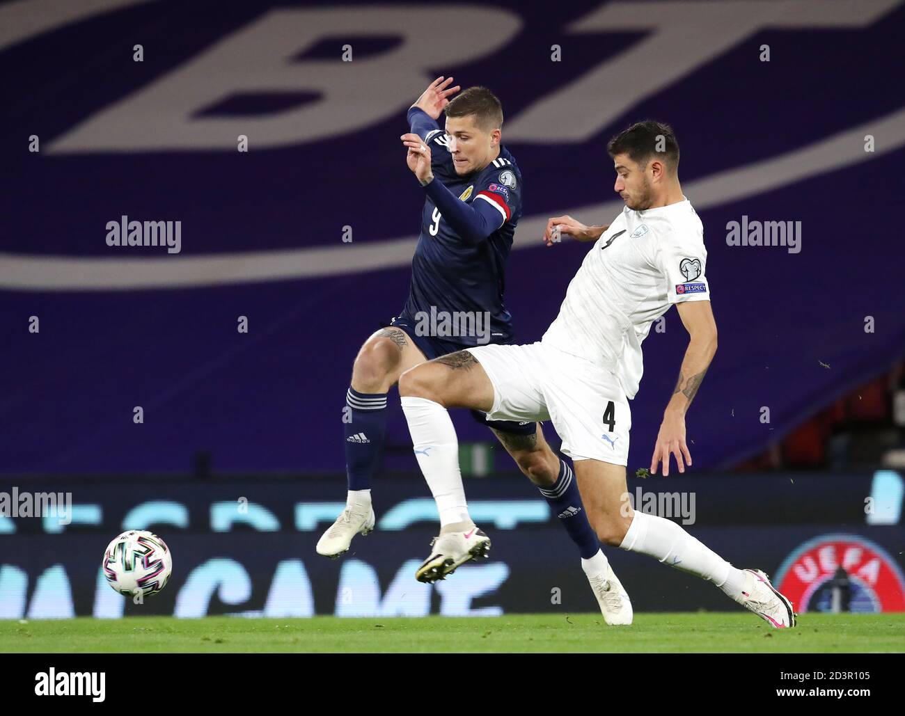 Israel's Nir Biton (right) challenges Scotland's Lyndon Dykes during ...