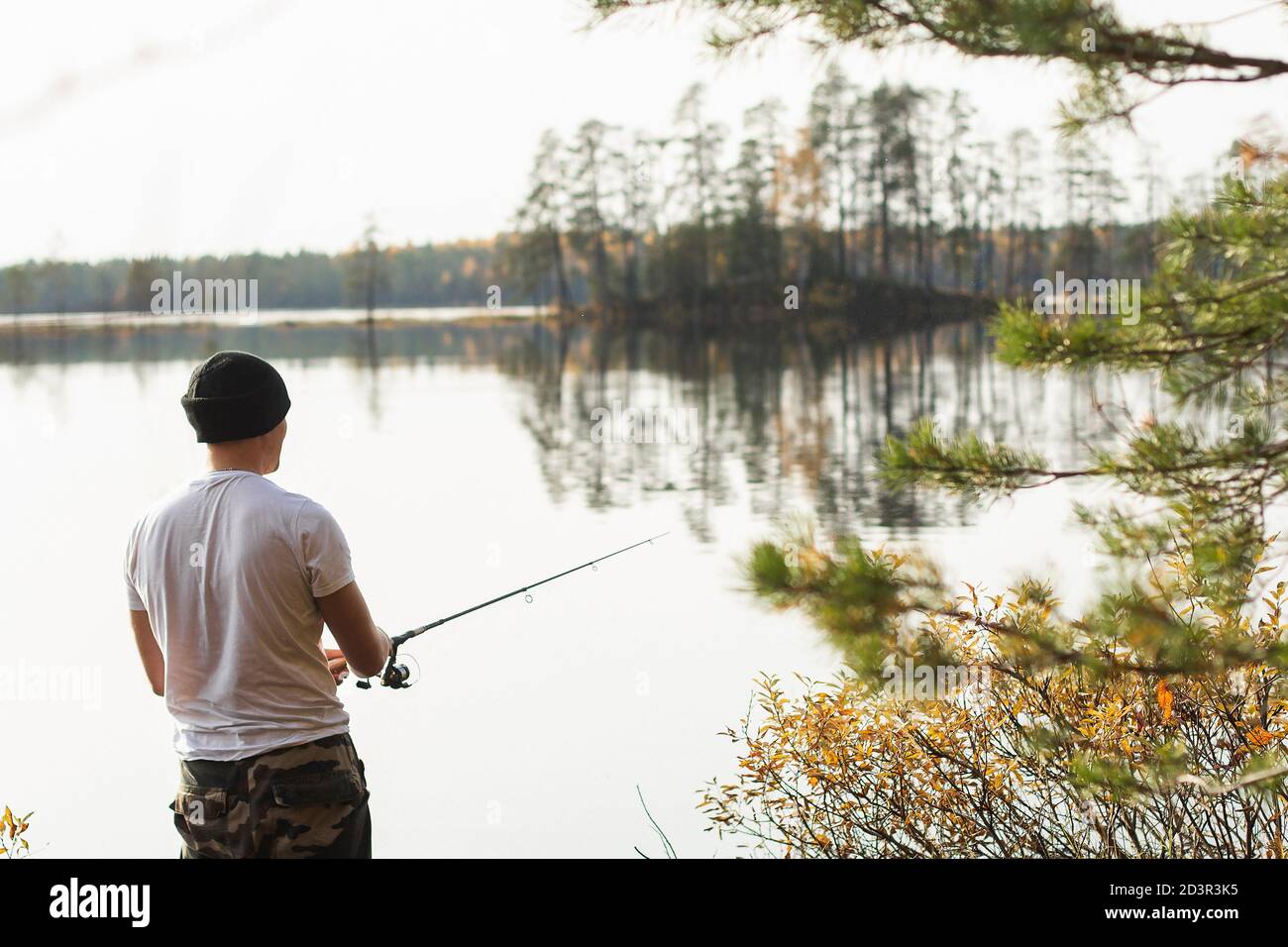 Back view person spin fishing hi-res stock photography and images - Alamy