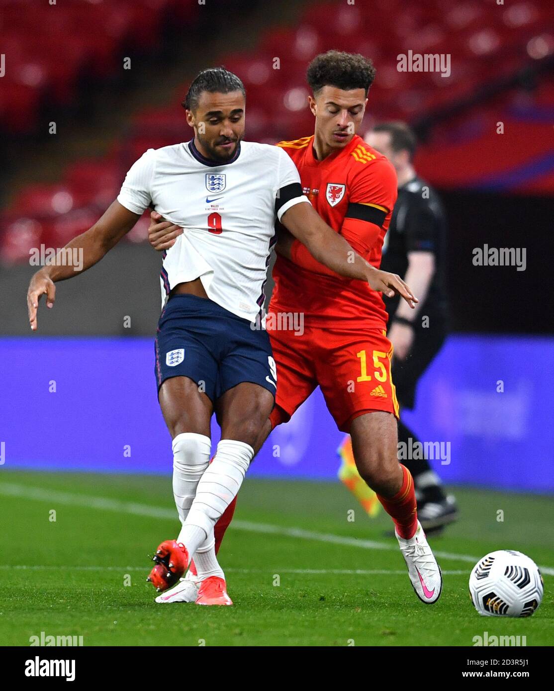 England's Dominic Calvert-Lewin (left) and Wales' Ethan Ampadu battle ...