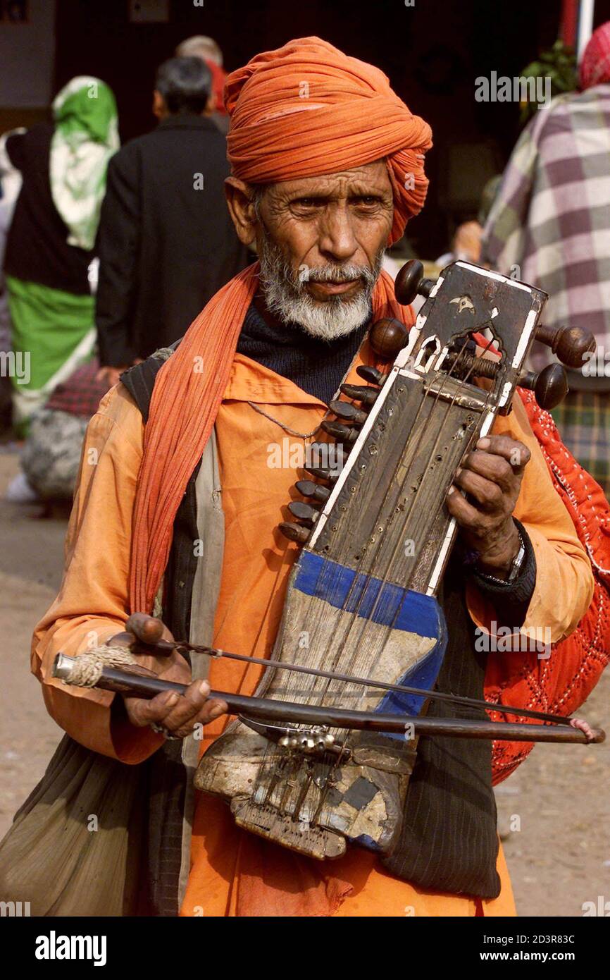 Indian man plays musical instrument High Resolution Stock Photography ...