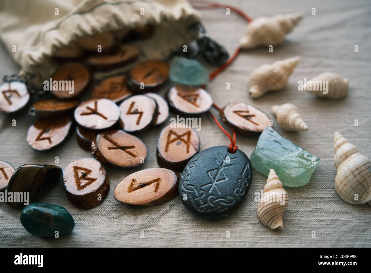 homemade wooden runes in a canvas bag with a talisman runoscript Stock ...